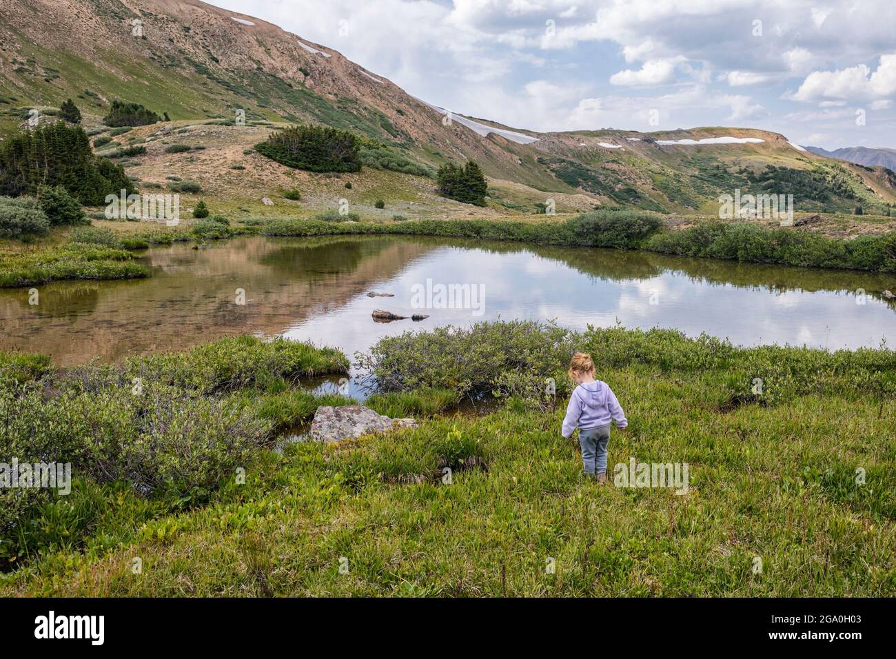 Young girl in front of an alpine lake, Colorado Stock Photo - Alamy