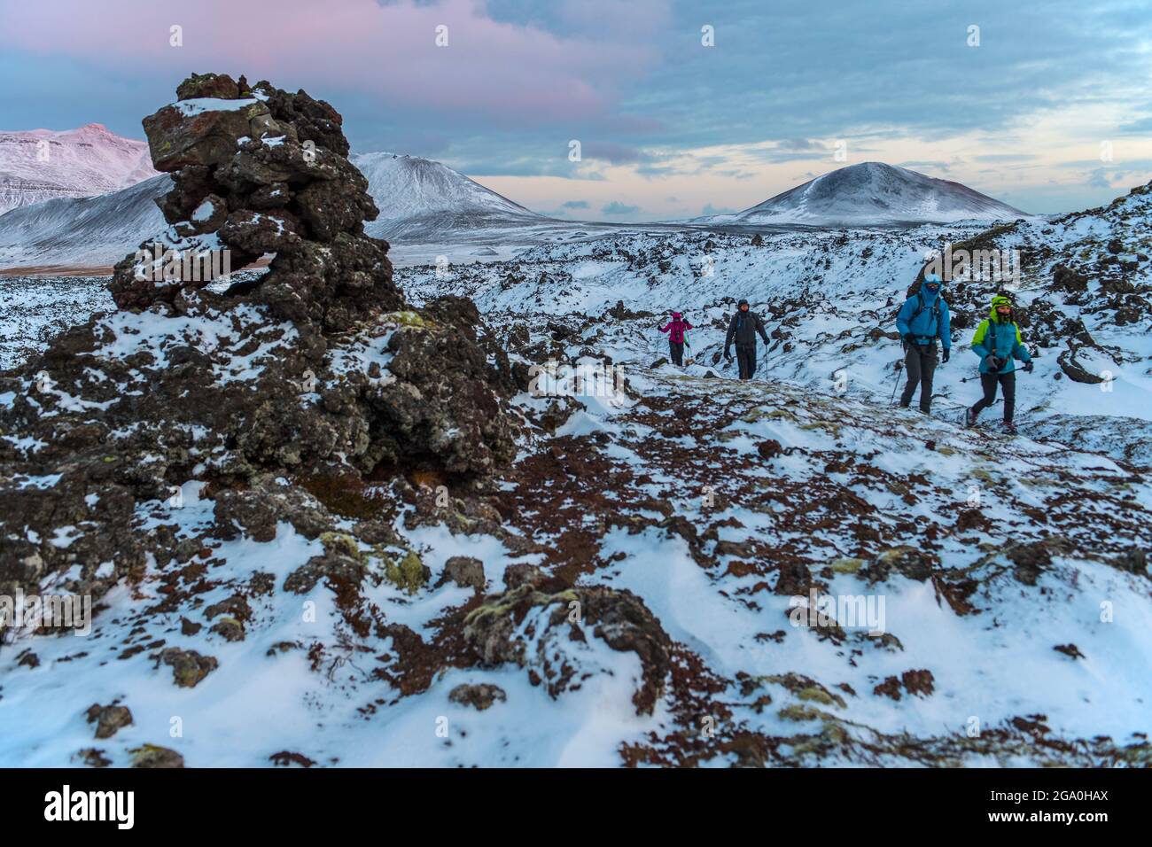 people hiking through the frozen landscape in the west of Iceland Stock ...