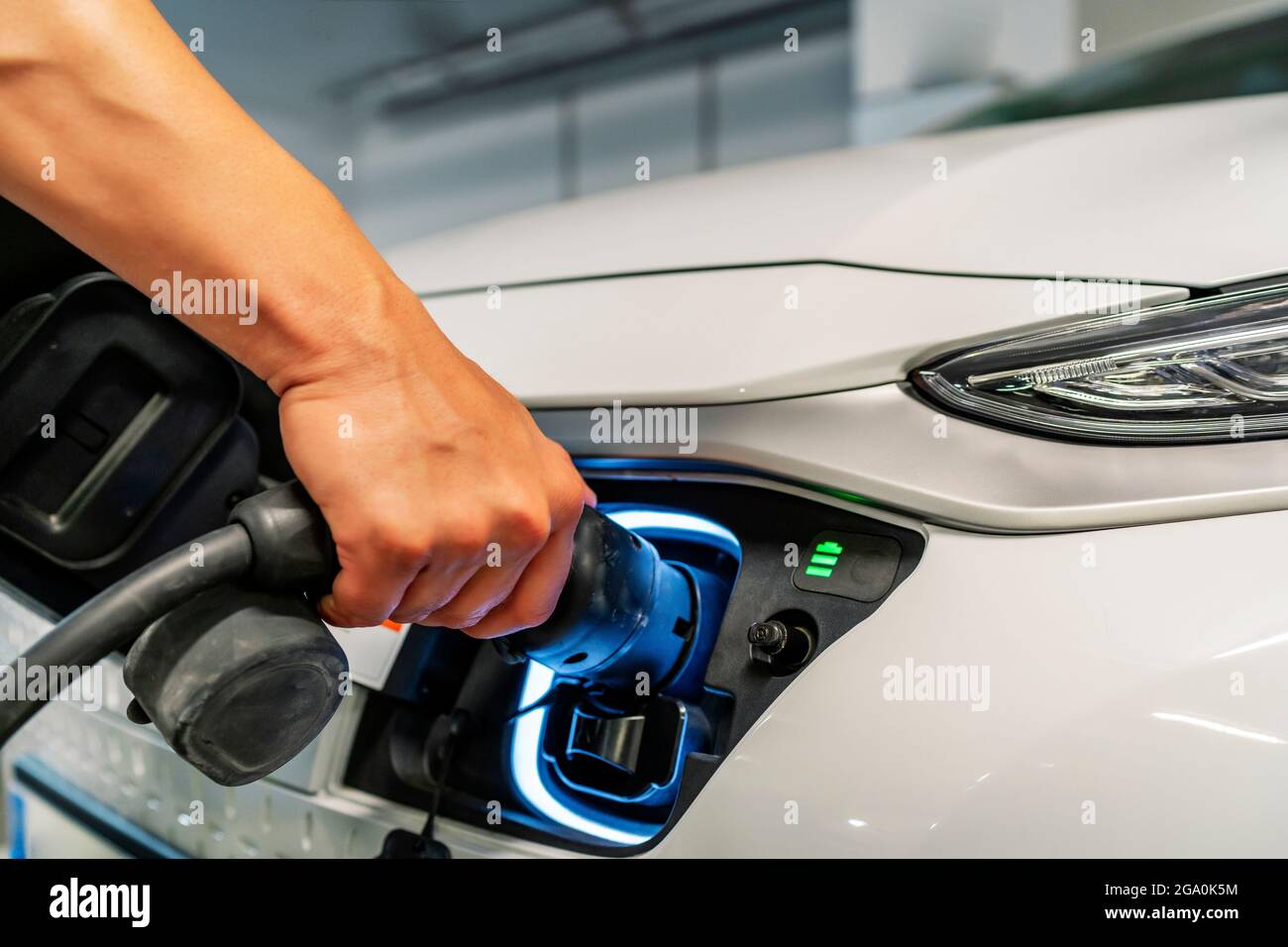 man starting his electric vehicle Stock Photo - Alamy