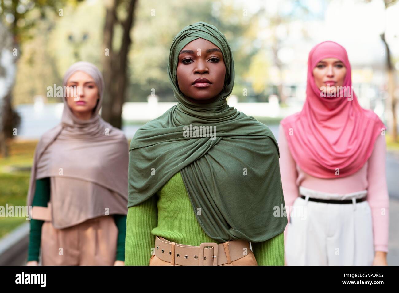 Three women posing camera hi-res stock photography and images - Alamy