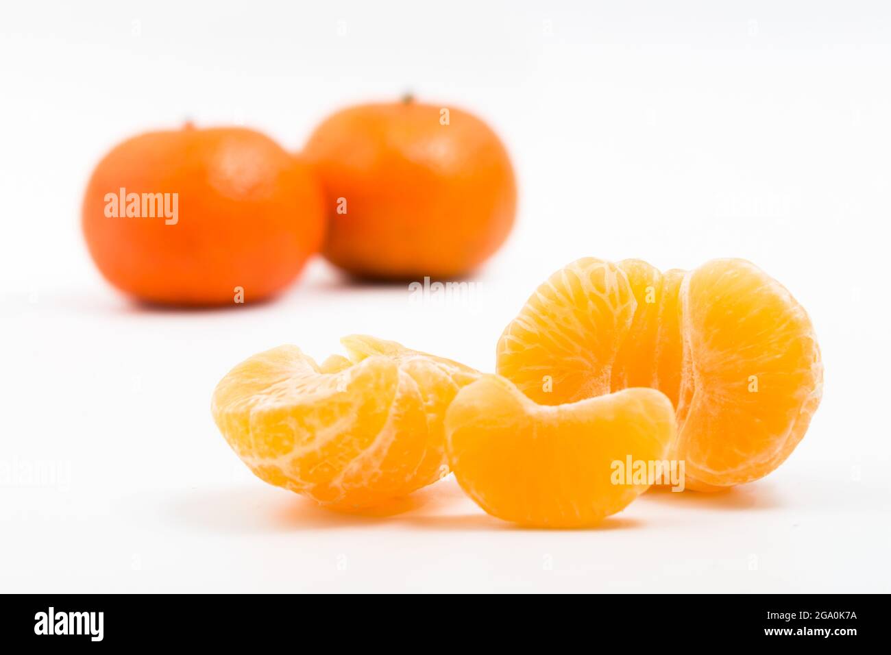 Two tangerines on white background Stock Photo - Alamy