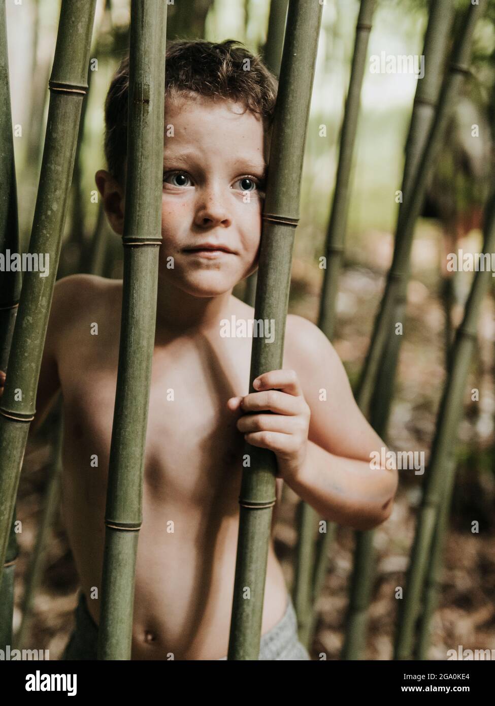 WILD CHILD AMONG BAMBOO IN NATURE Stock Photo - Alamy