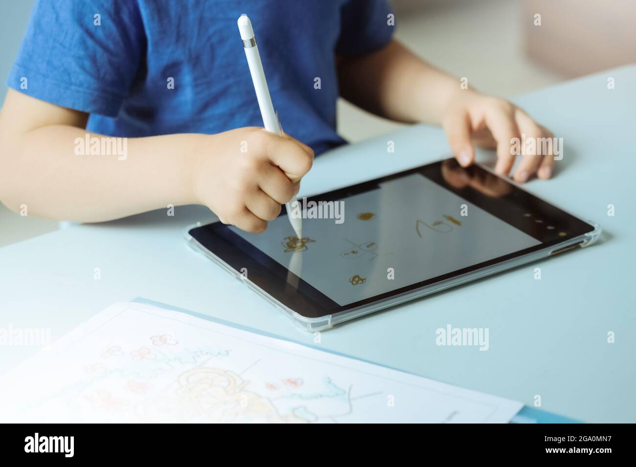 Hands of Children drawing with digital pen on the tablet, image with ...