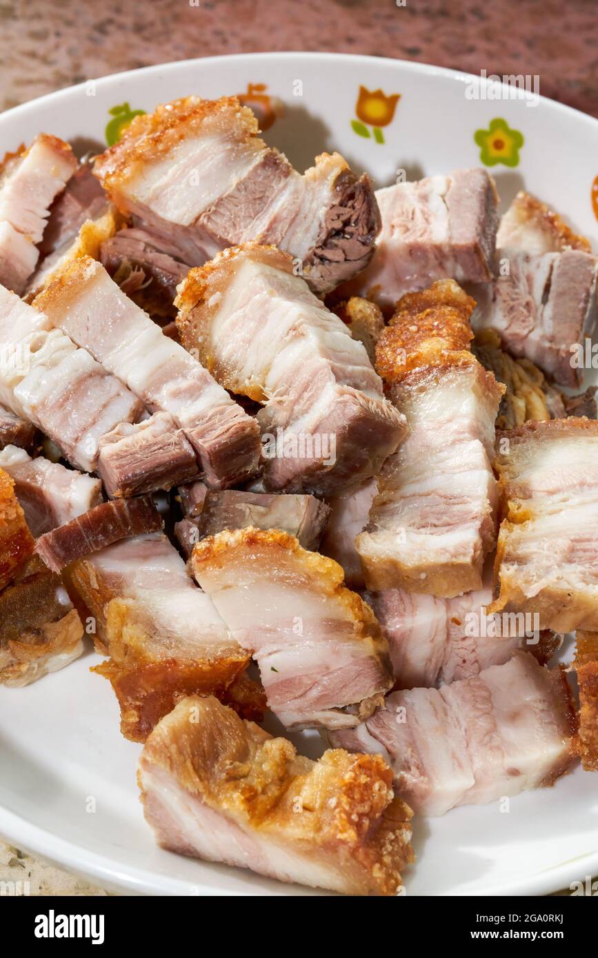 A dish of Cantonese stew, crispy roast pork close-up Stock Photo - Alamy