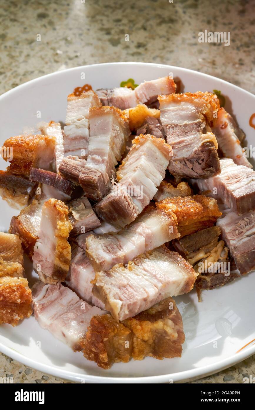 A dish of Cantonese stew, crispy roast pork close-up Stock Photo - Alamy