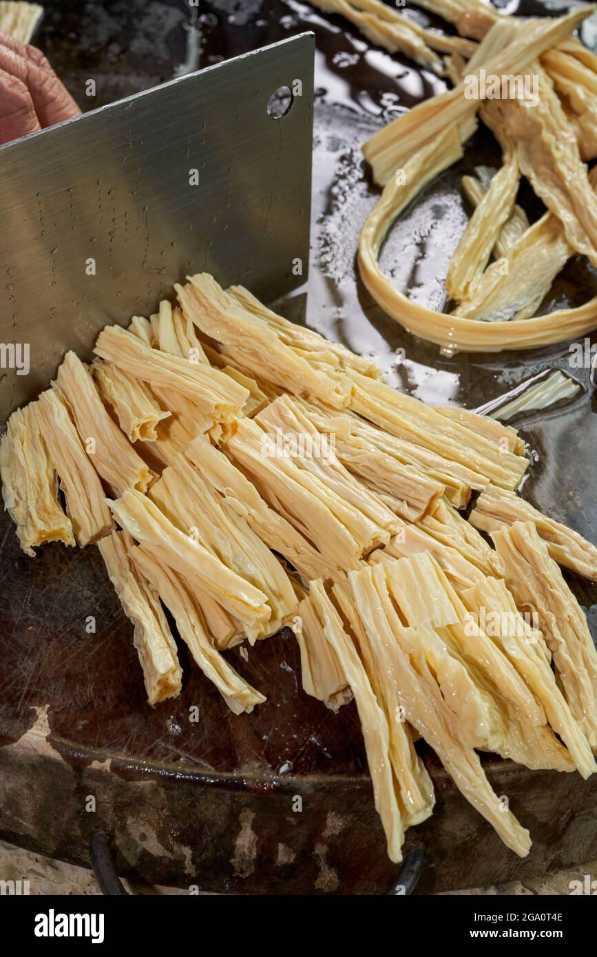A Cantonese chef is cutting the soaked yuba Stock Photo - Alamy