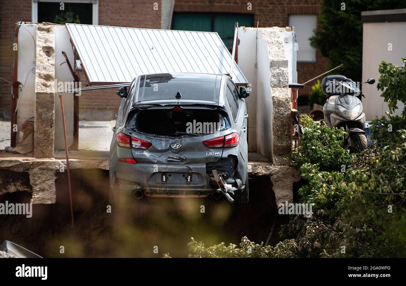 Erftstadt Blessem, Germany. 28th July, 2021. A car stands destroyed in ...