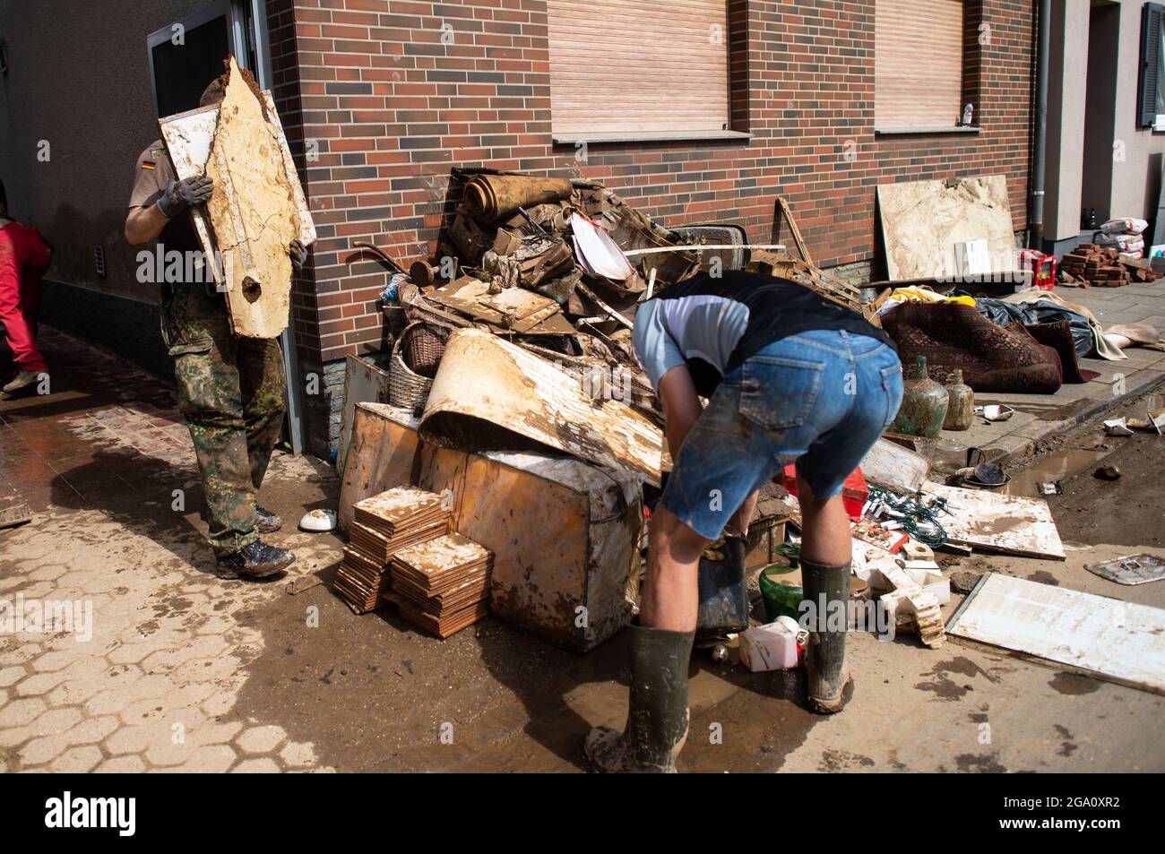 Erftstadt Blessem, Germany. 28th July, 2021. A Bundeswehr soldier and a ...