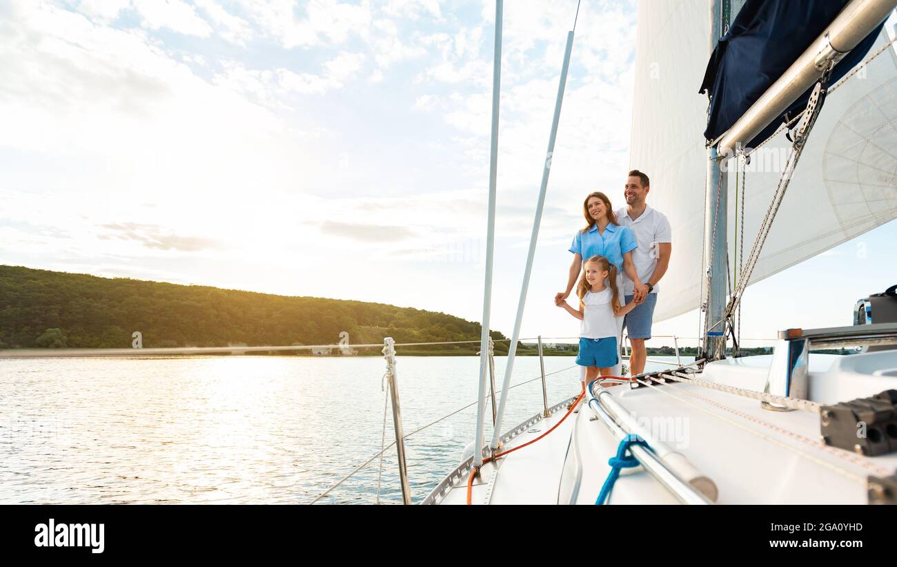 Joyful Family Standing On Sailboat Deck Enjoying Yacht Ride Stock Photo ...