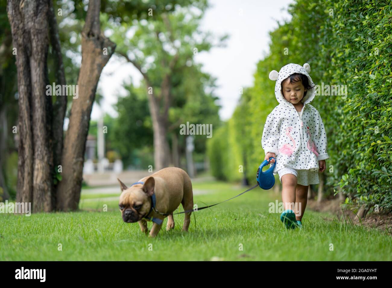 Selective focus shot of a SouthEast Asian little girl walking out the ...