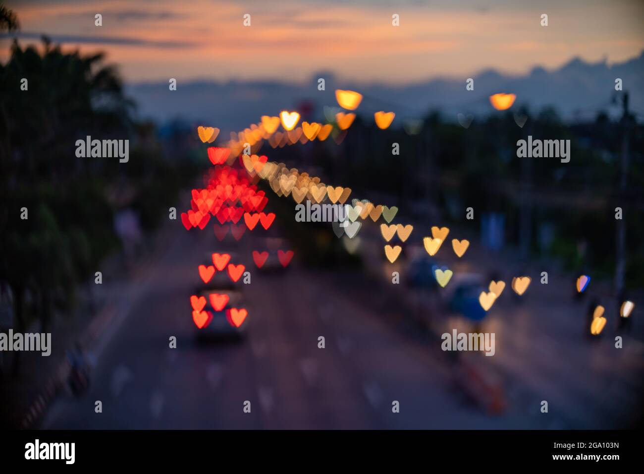Beautiful heart-shaped bokeh lights with a blurred background at sunset ...