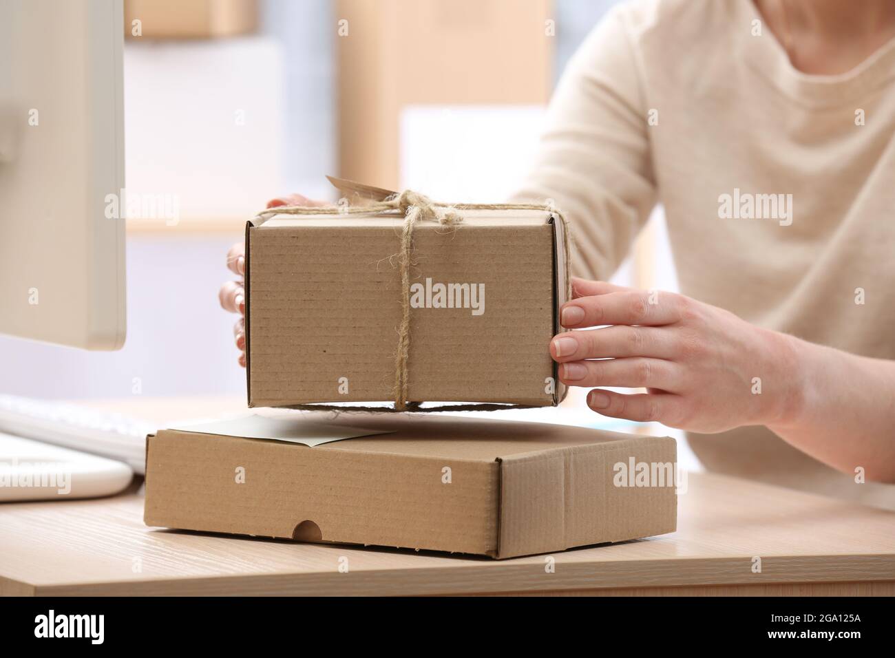 Cardboard boxes on work place Stock Photo - Alamy