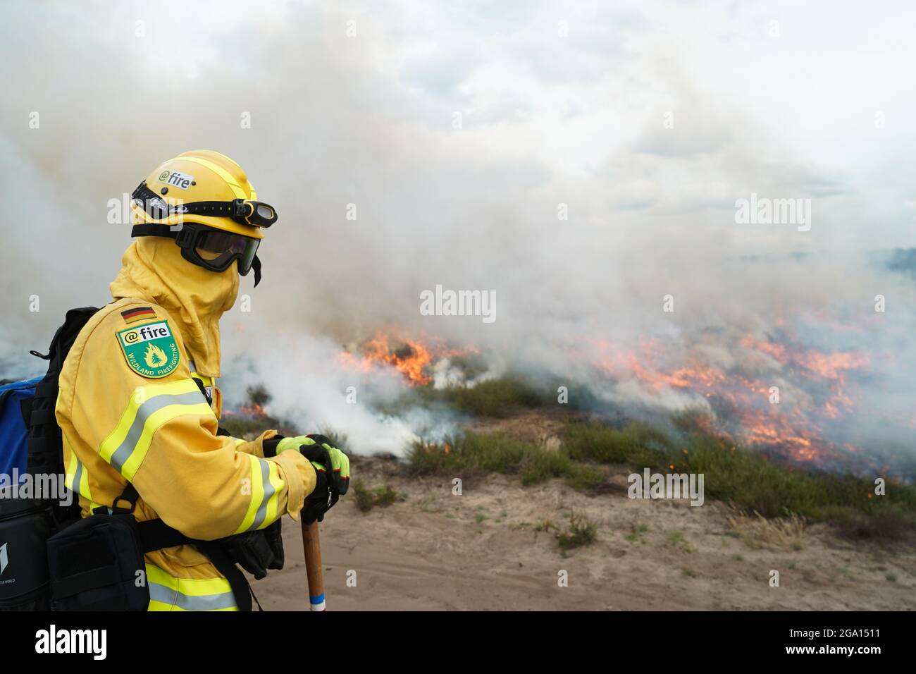 28 July 2021, Brandenburg, Brück: Members of the organisation @fire ...