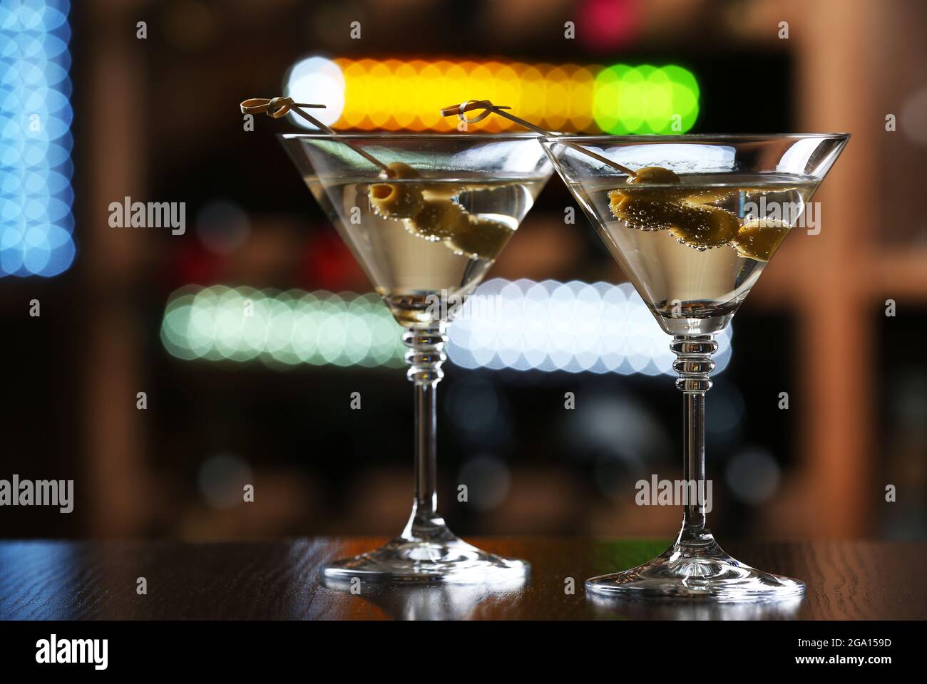 Glasses of cocktails on bar background Stock Photo - Alamy