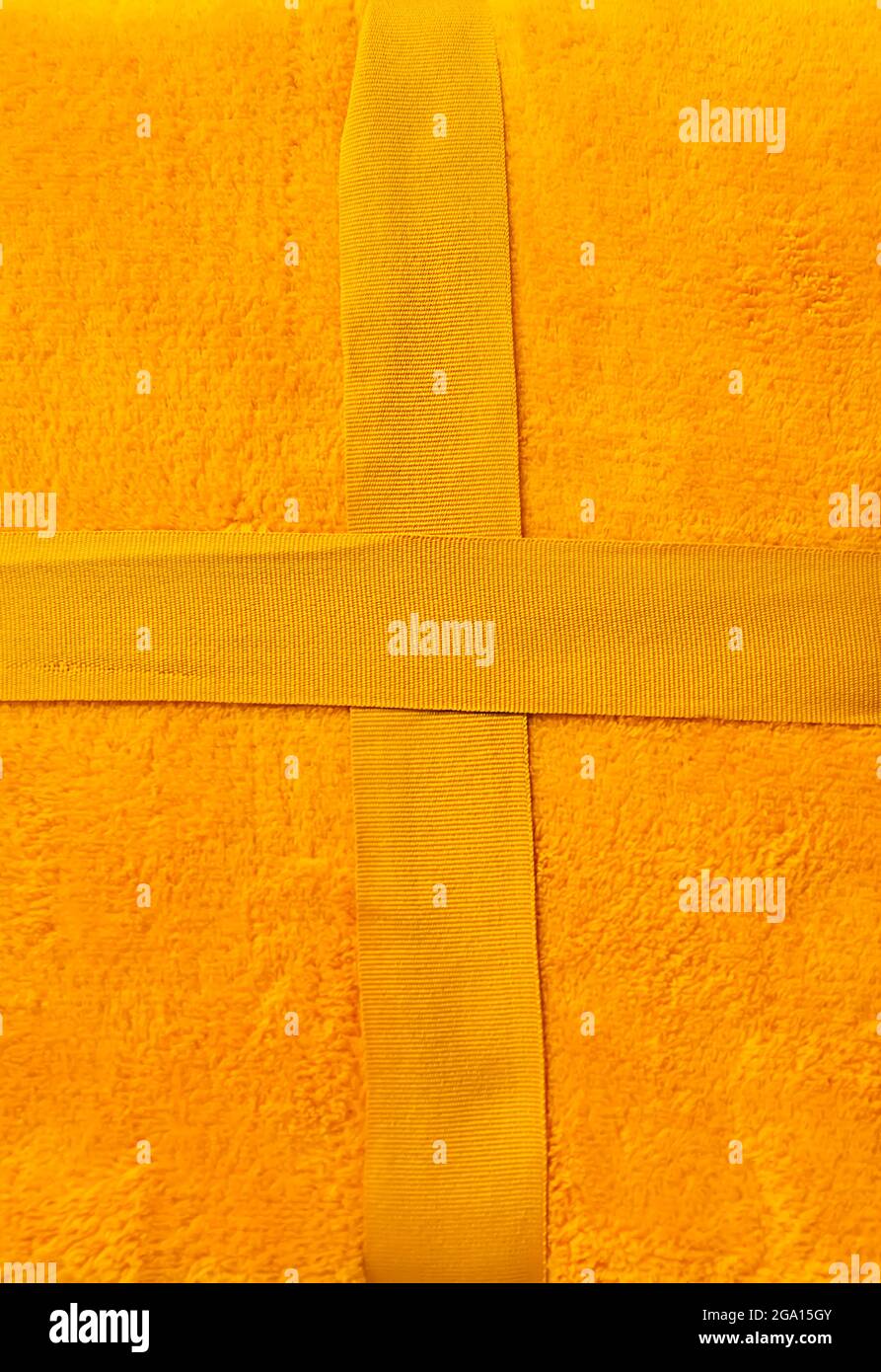 Warm soft yellow textile surface close up. Synthetic fabric texture ...