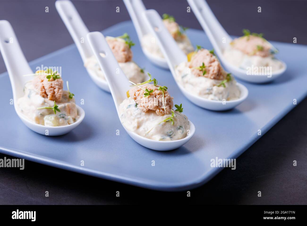 Cold appetizer made from cod liver, cod caviar, olives, cucumber and ...