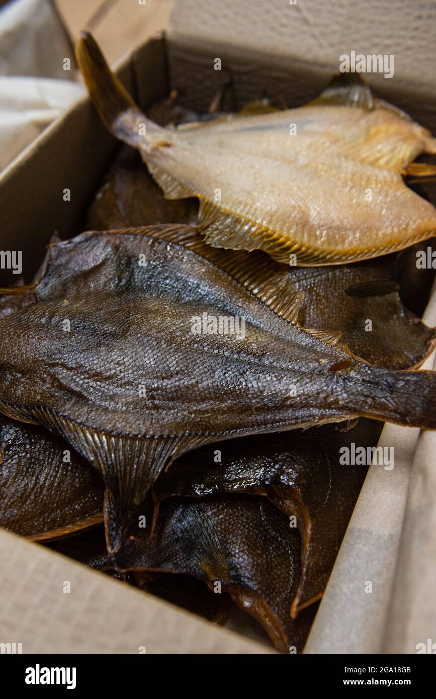 Smoked fish in craft paper box. Ready for delivery production. Smoked ...