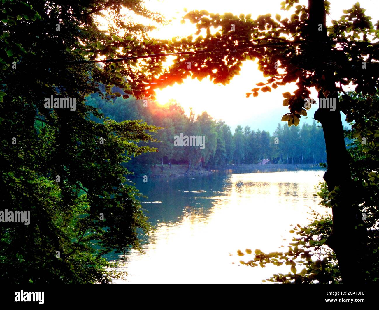 sunset over the Mogosa lake - Maramures Stock Photo - Alamy