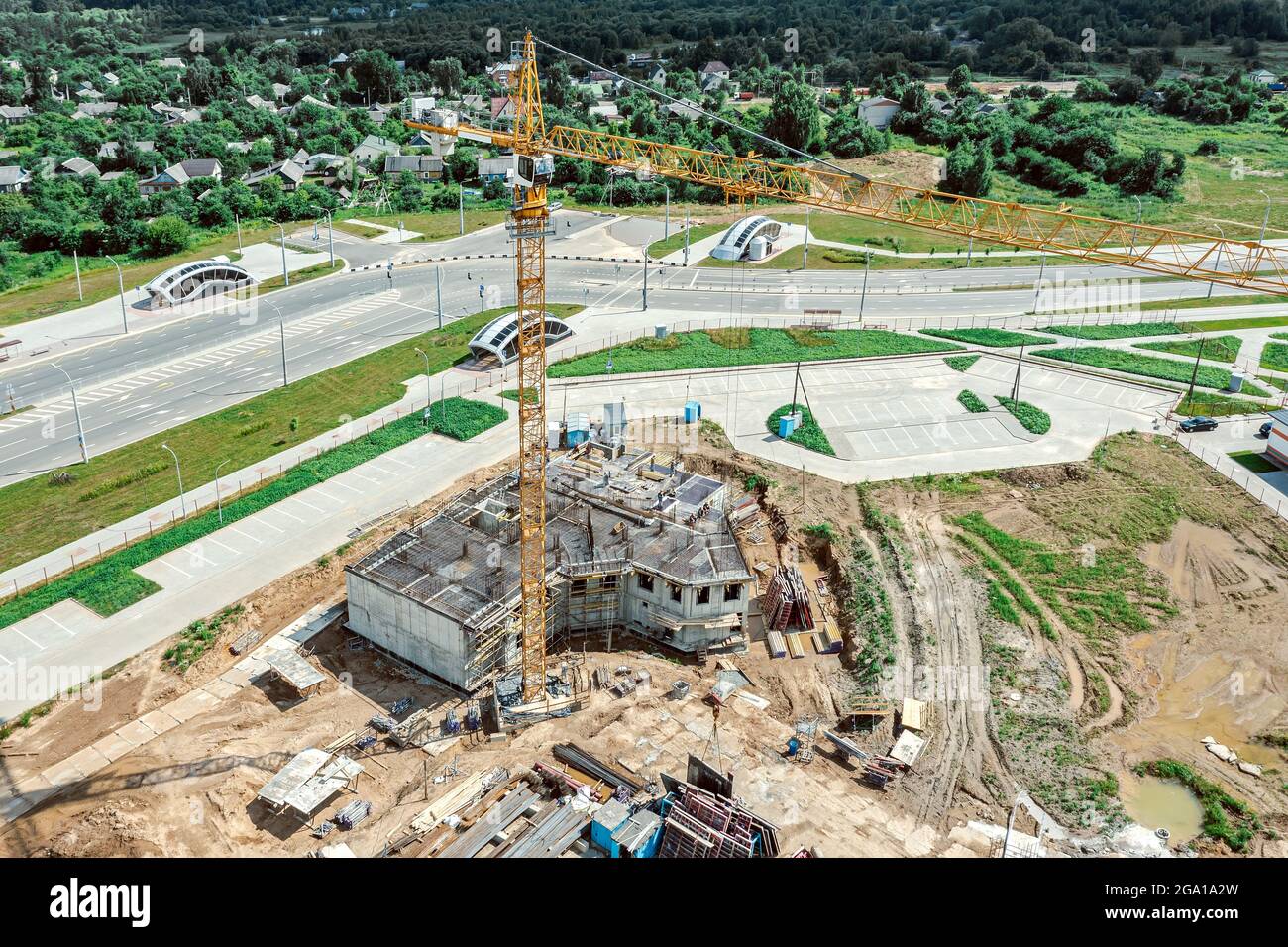 construction site of high-rise apartment building with working yellow ...