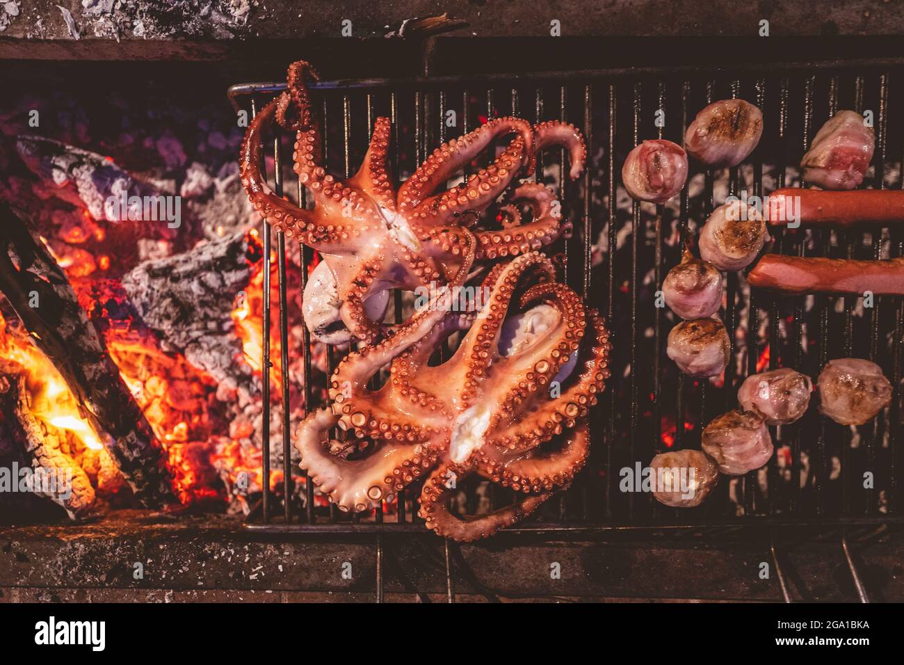 Summer barbecue with octopus in the camping in Puglia Stock Photo - Alamy
