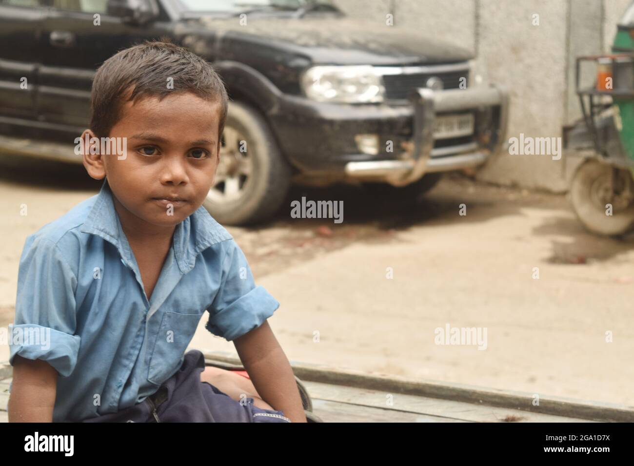 Young Poor Kid In School Dress Stock Photo - Alamy