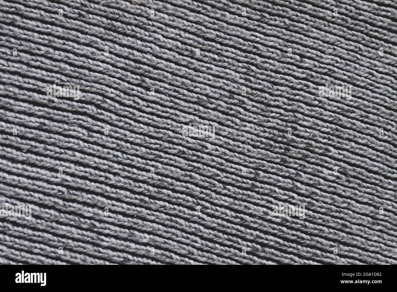 Woolen knitted surface of grey textile close up. Natural textile ...
