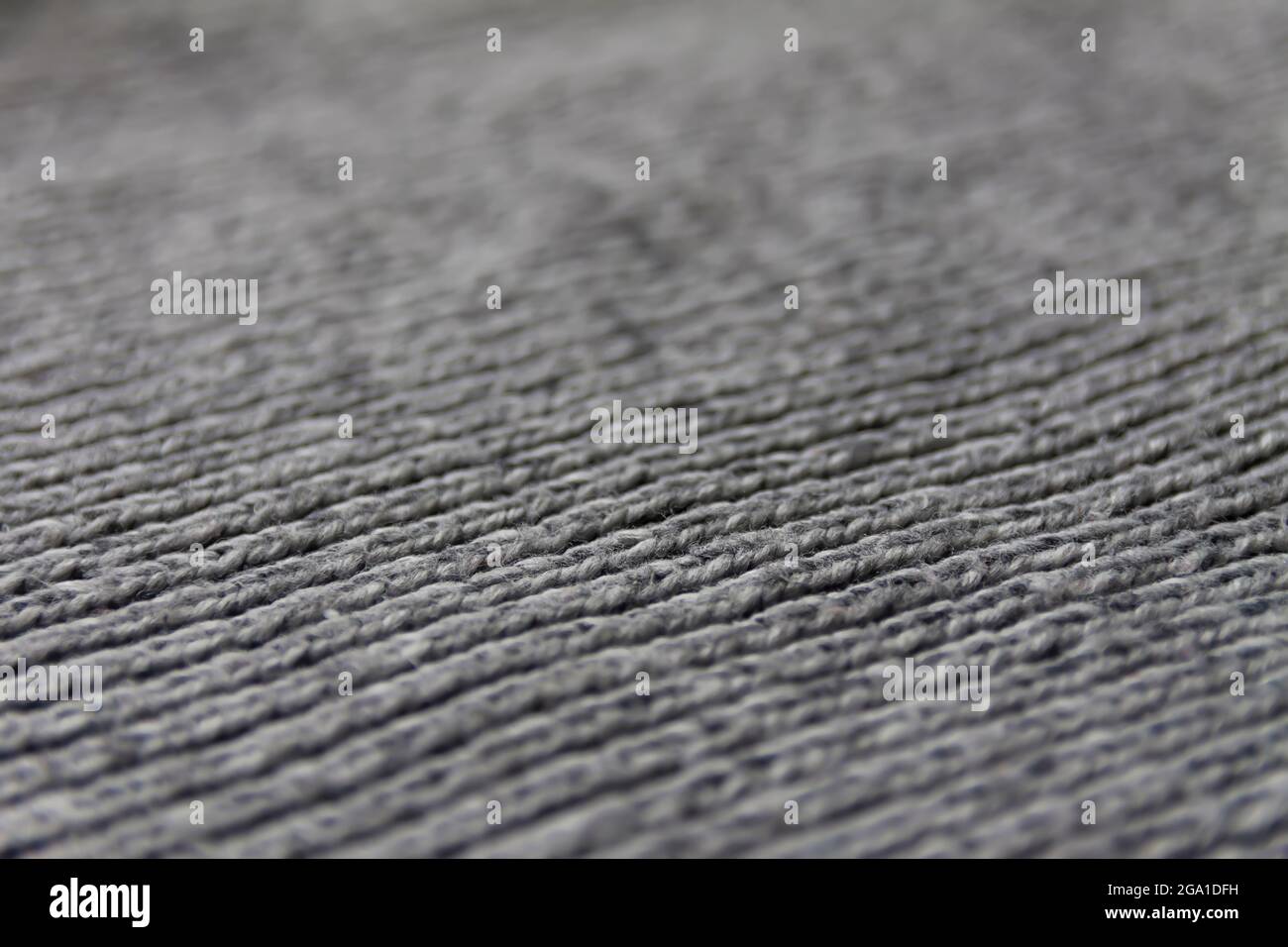 Woolen knitted surface of grey textile close up. Natural textile ...