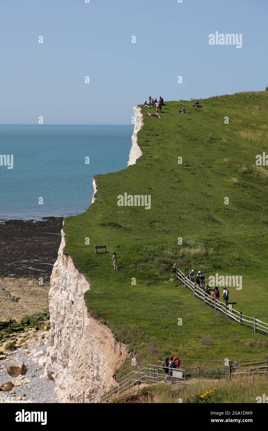 Risking Lives at Edge of Cliff Stock Photo - Alamy