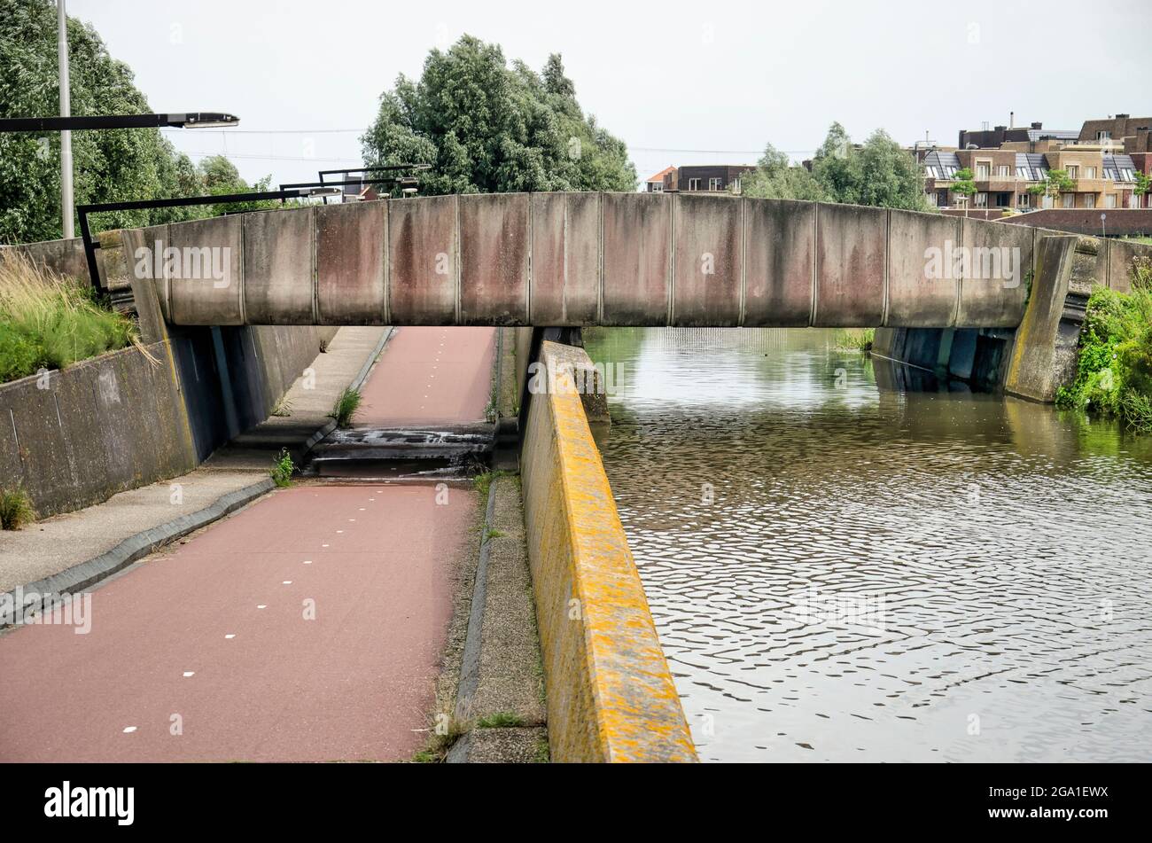 Lansingerland, The Netherlands, July 27, 2021: concrete bridge across a ...