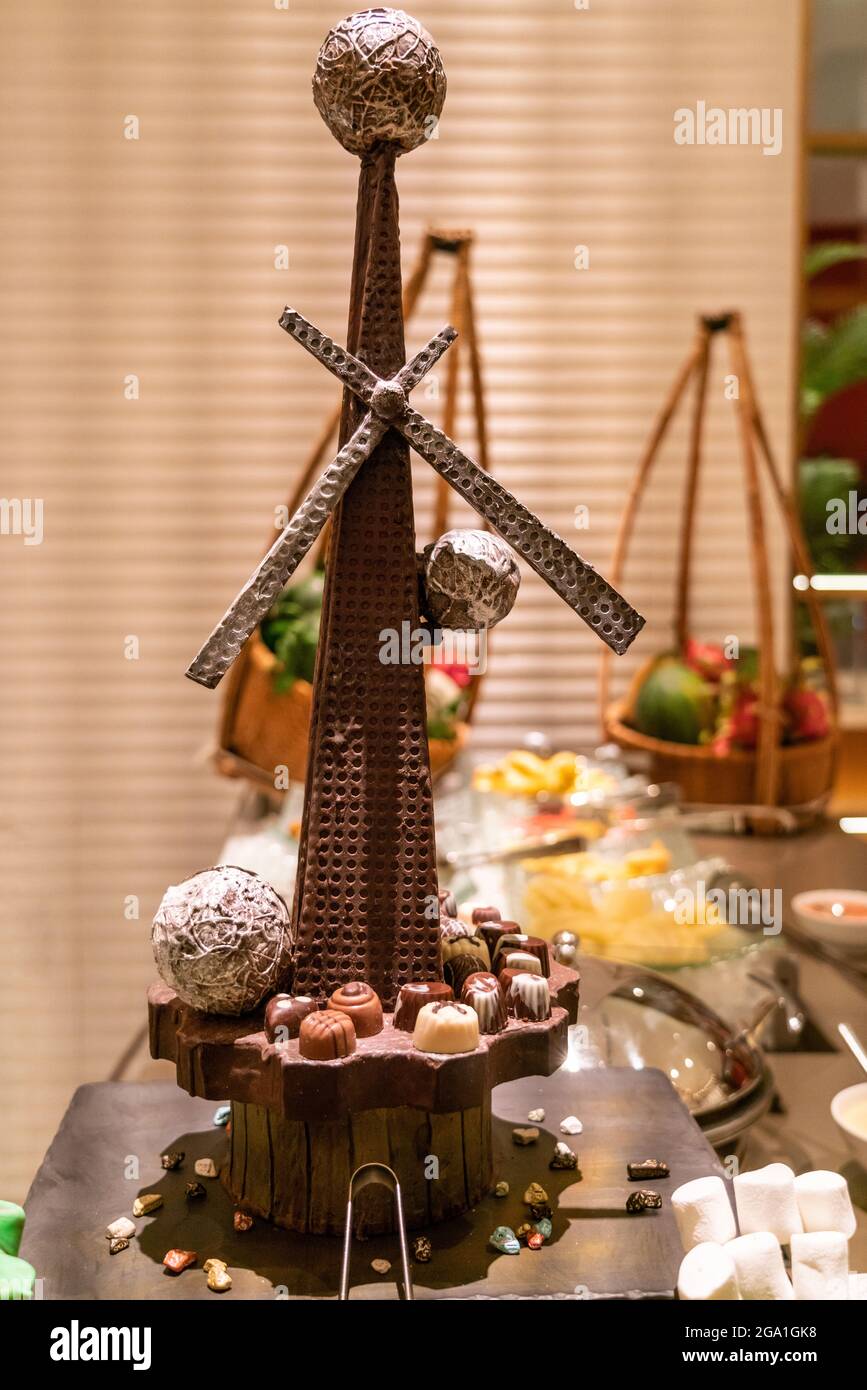 Chocolate tower, candy in the bakery Stock Photo - Alamy