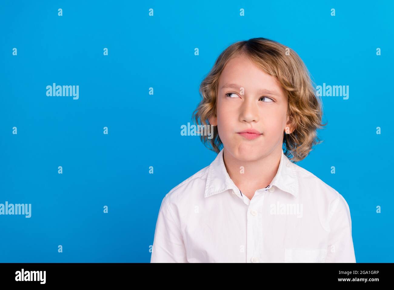 Portrait of attractive cunning sly bewildered boy overthinking copy ...