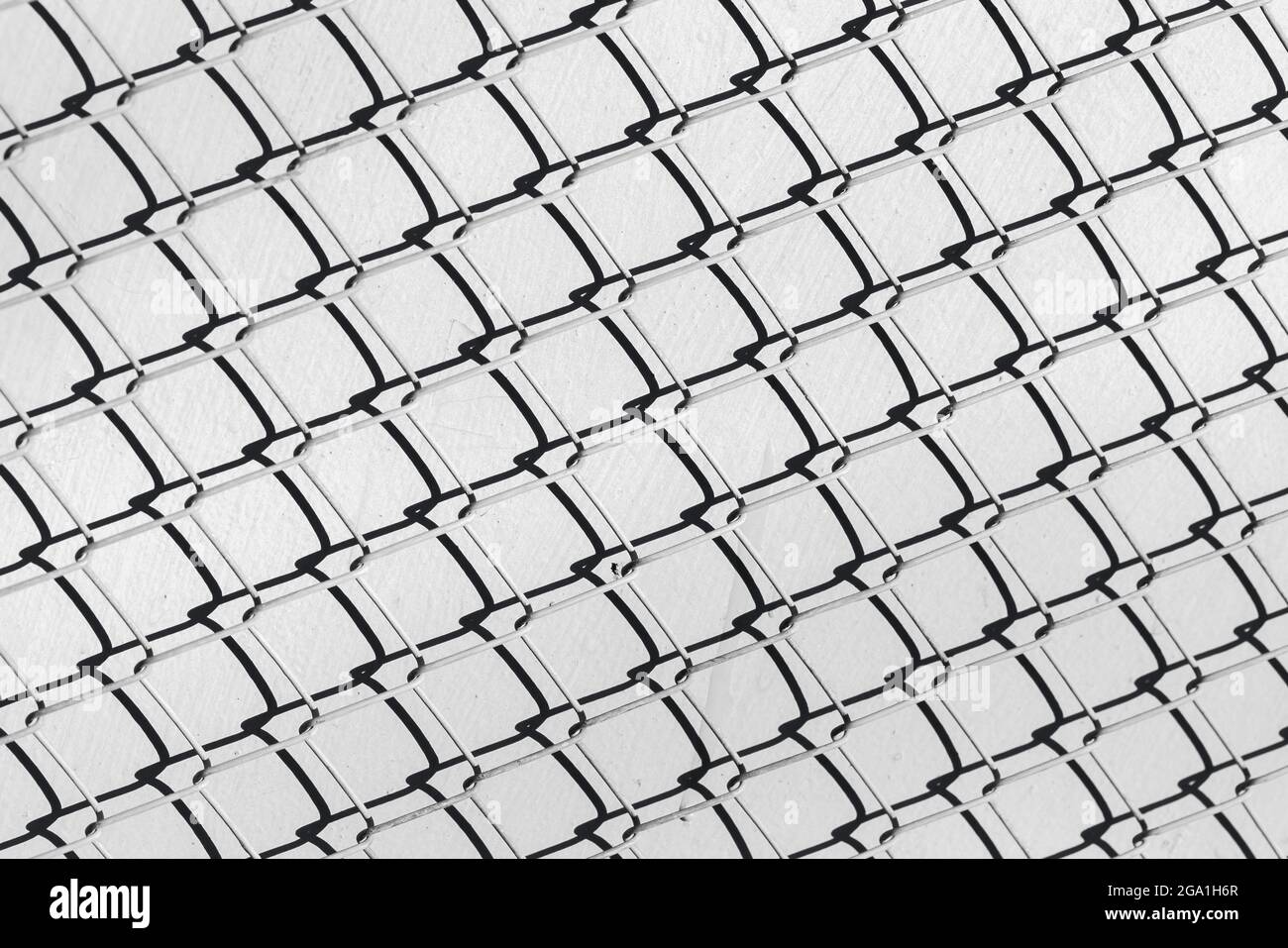 Fence cage Rabitz covers gray concrete wall, industrial background ...