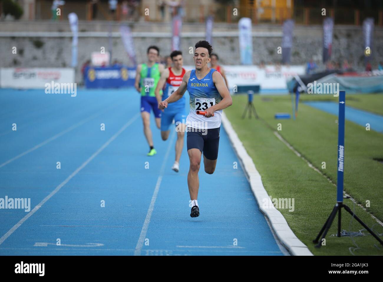 ISTANBUL, TURKEY - JUNE 13, 2021: Athletes running running 4x400 metres ...