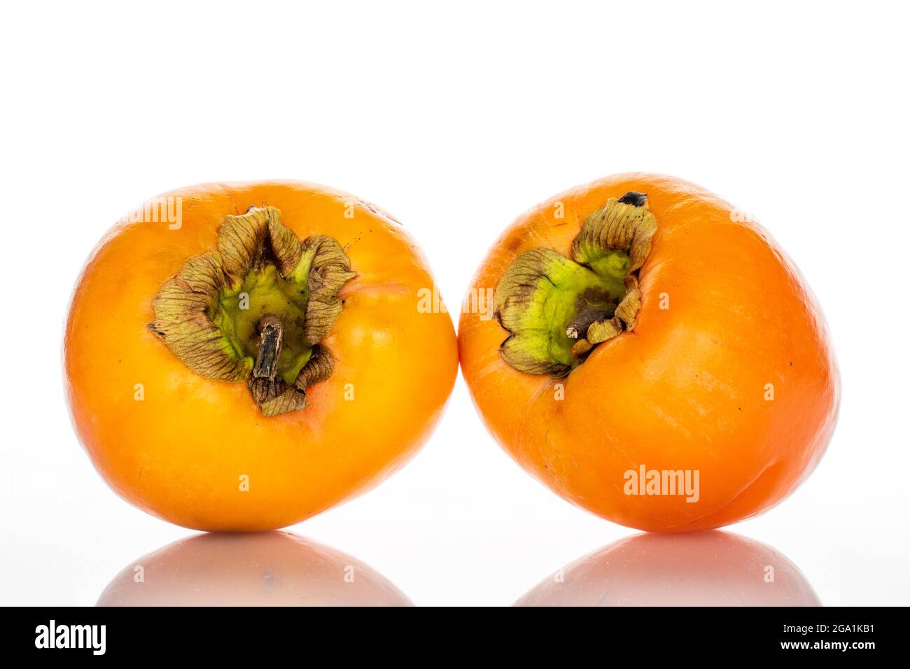 Two ripe organic persimmons, close-up, isolated on white Stock Photo ...