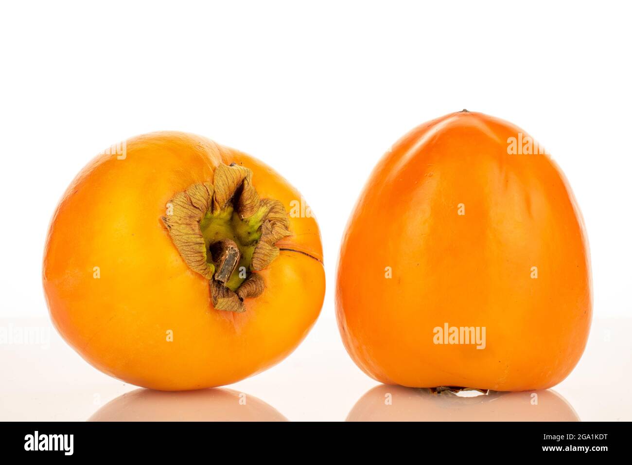 Two ripe organic persimmons, close-up, isolated on white Stock Photo ...