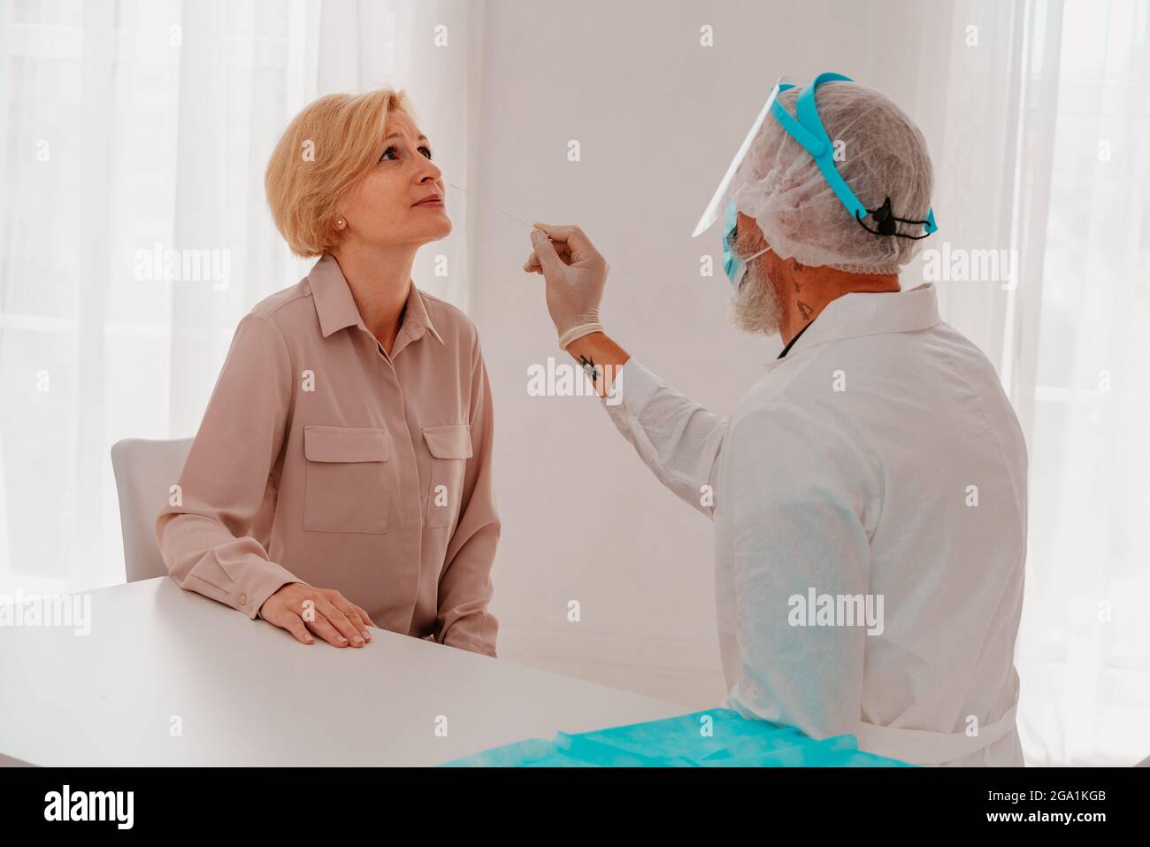 Doctor is checking the covid-19 virus with a tester Stock Photo - Alamy