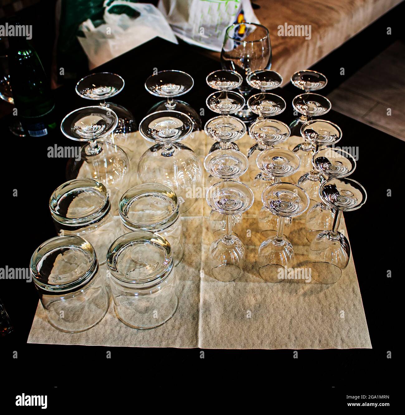 Many empty glasses for wine and cocktails on the table. Glasses on a ...