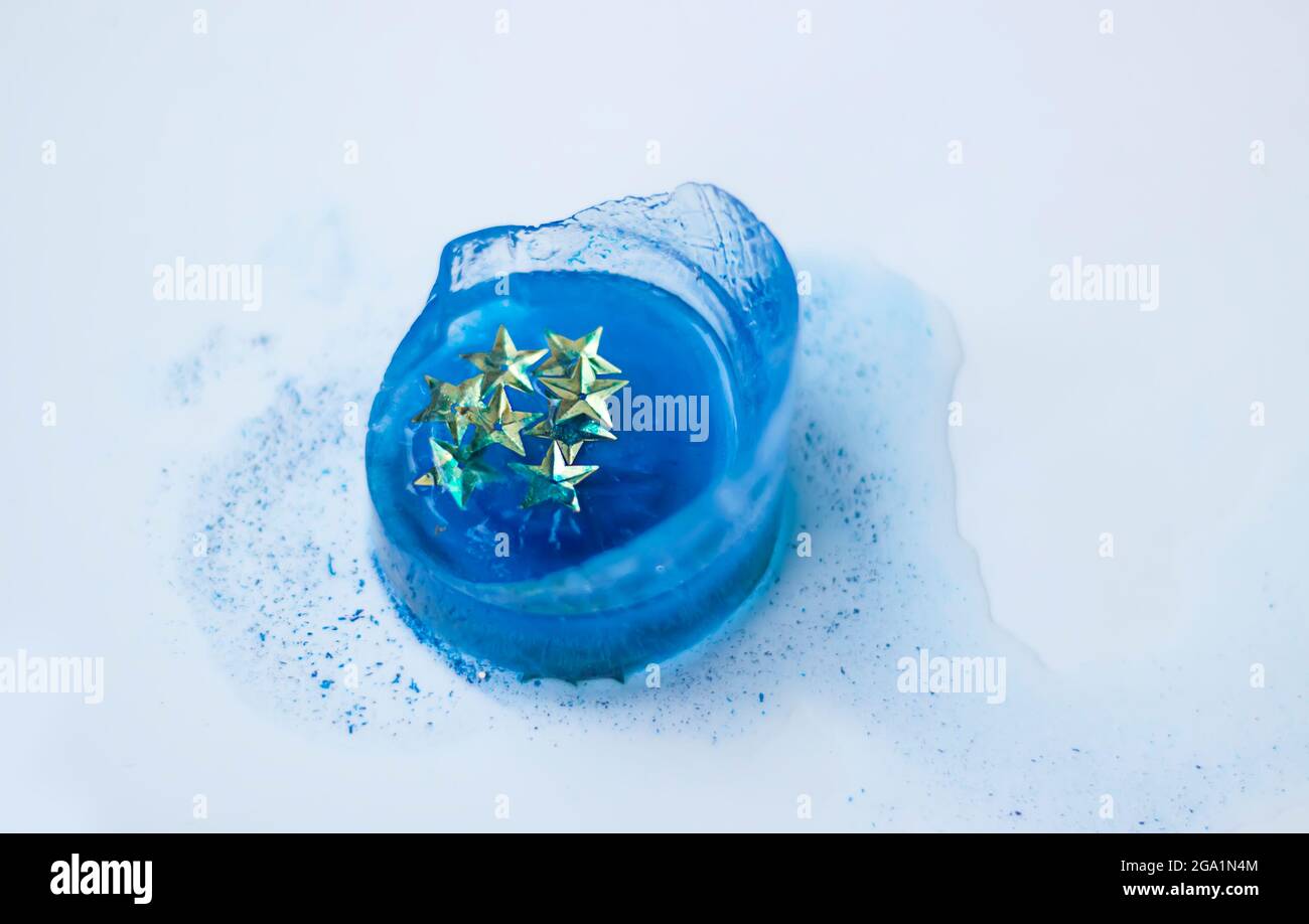 Ice candlestick with glitters on fresh snow background Stock Photo - Alamy