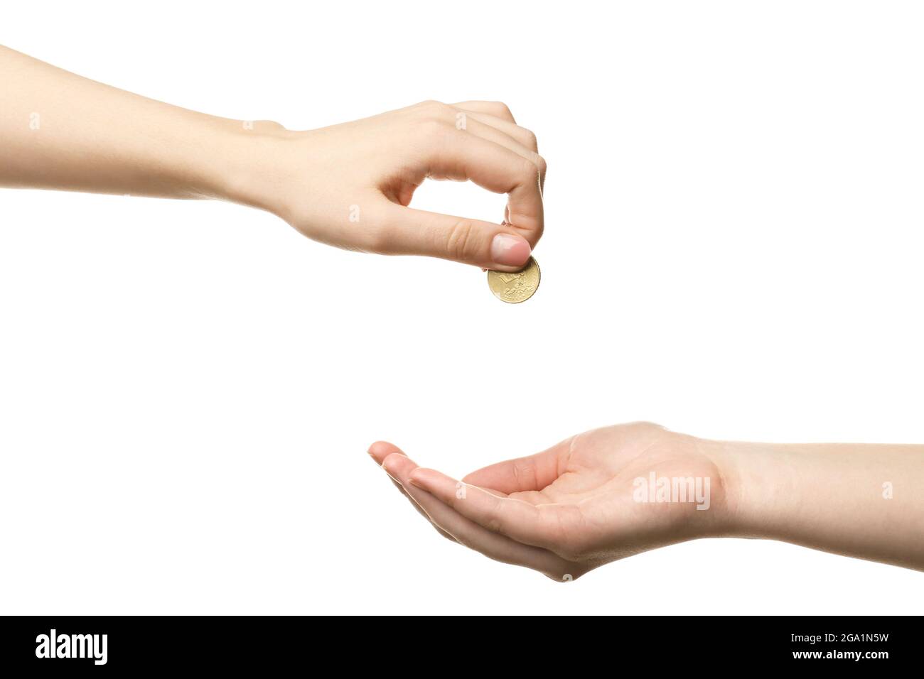 Female hand putting coin into another hand isolated on white Stock ...