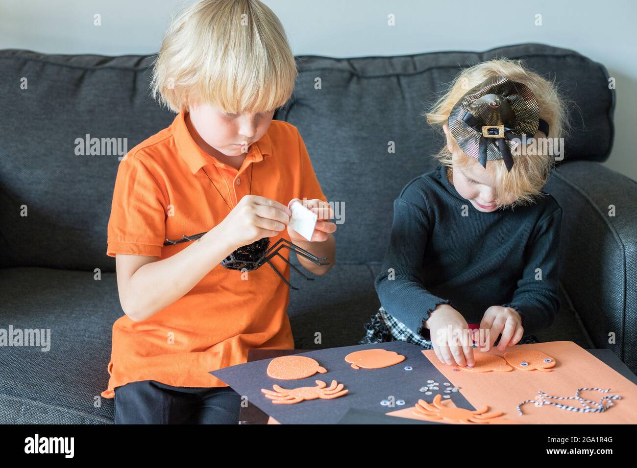 Halloween kids craft preparations and party concept. Little children ...