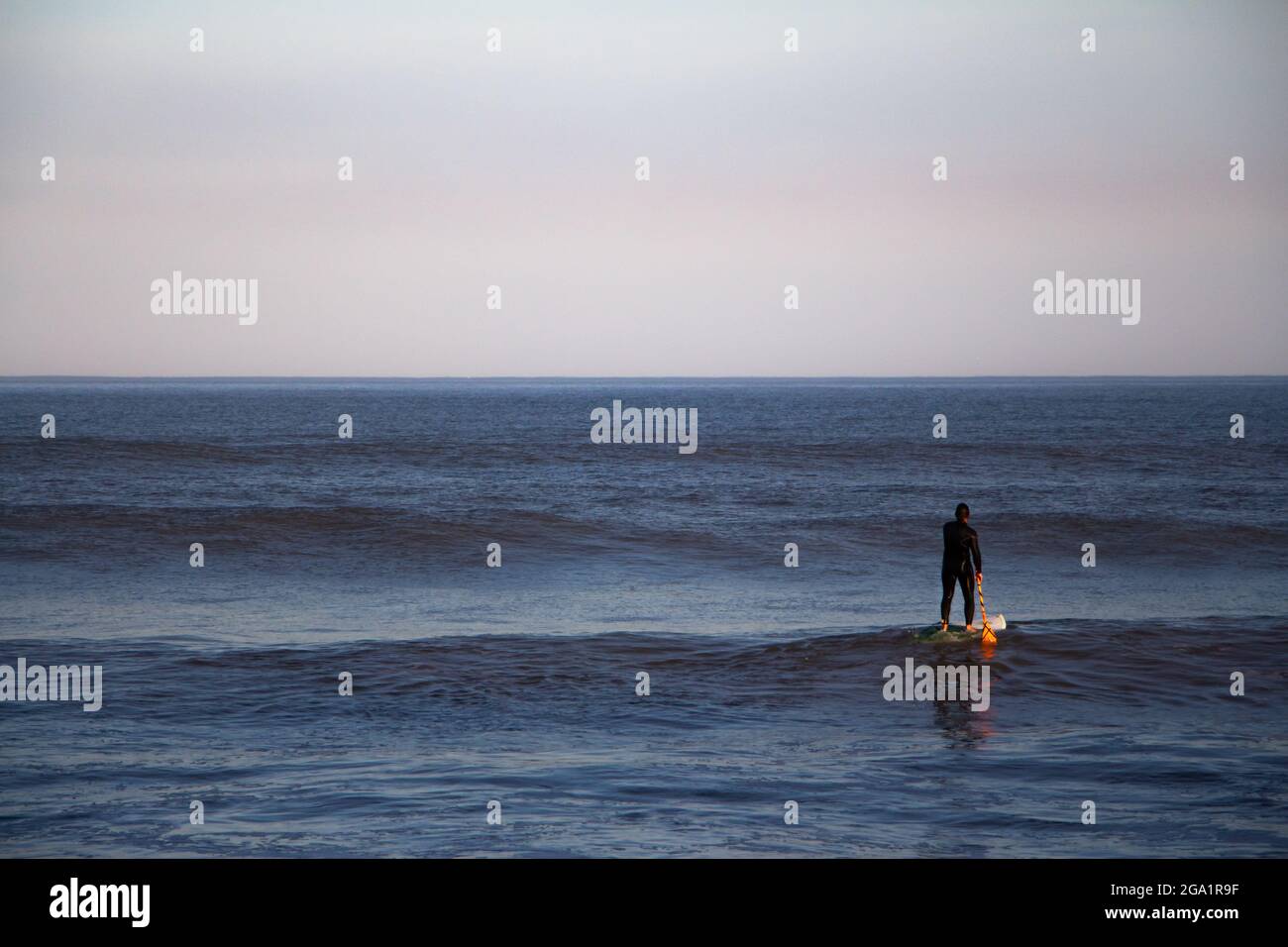 Person surfing on the sea waves under the sunlight in the daytime Stock ...