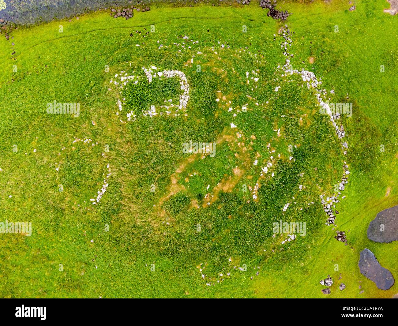Aerial view from drone of ruin of ancient Norse church near Kildonan on ...