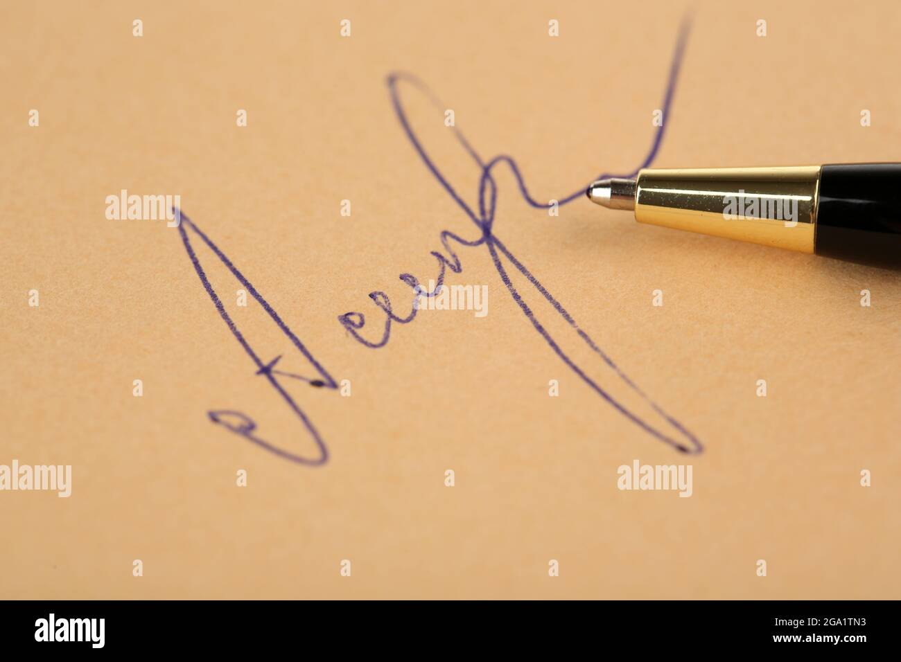 Pen and signature on paper background Stock Photo - Alamy