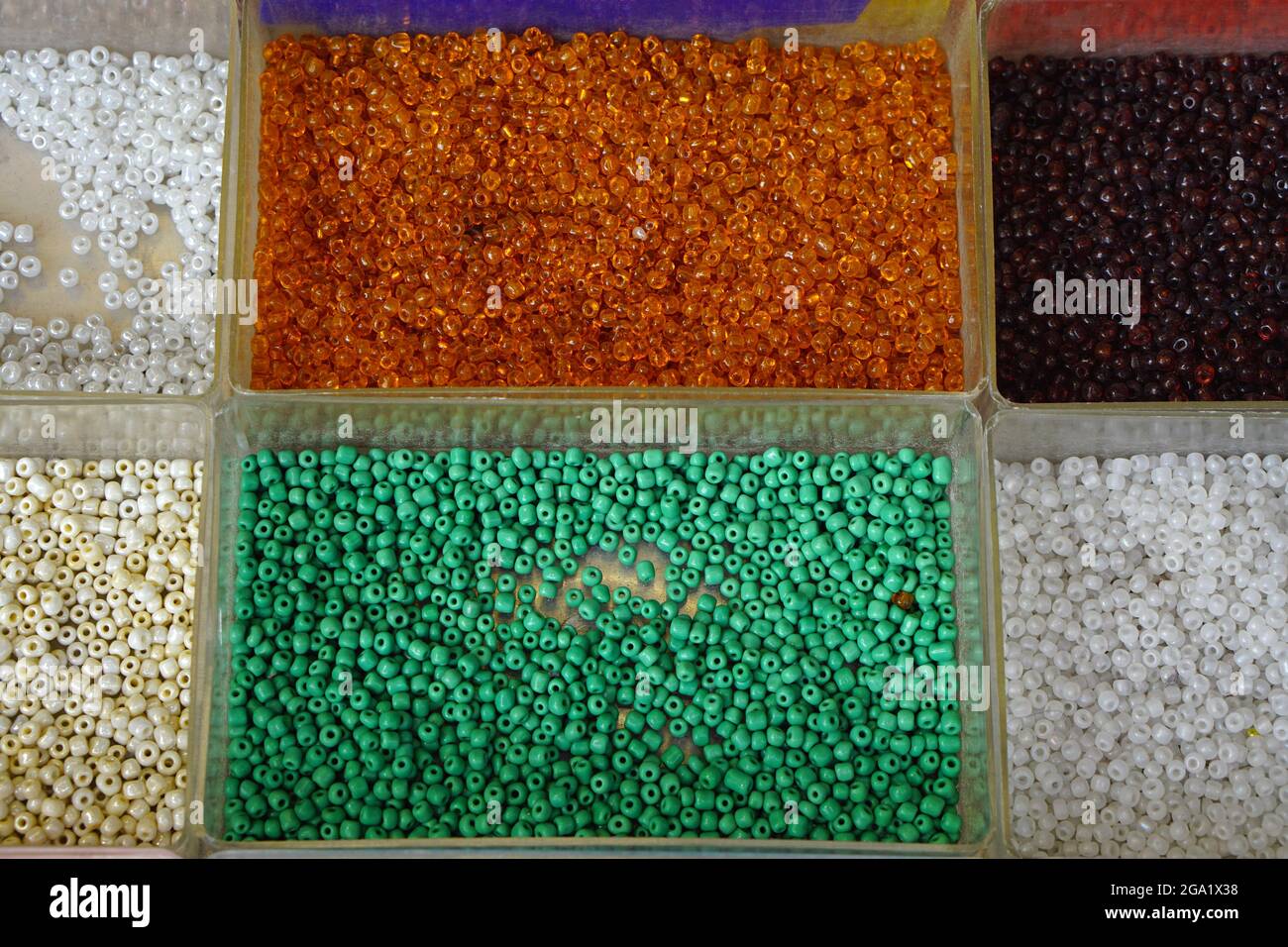 Different color plastic beads for craft work material Stock Photo - Alamy