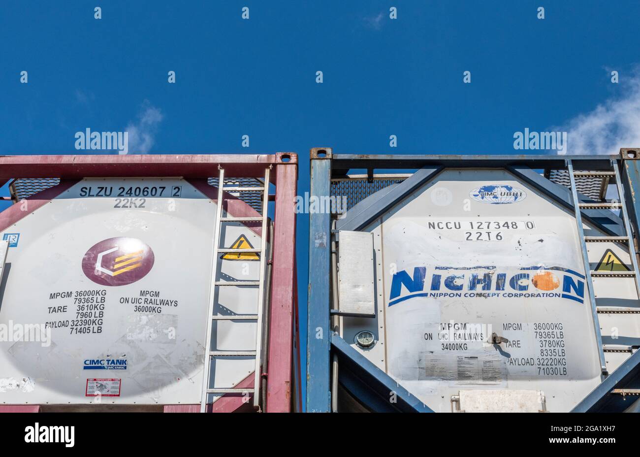 containers and containerised tanks stacked at a delivery depot in ...