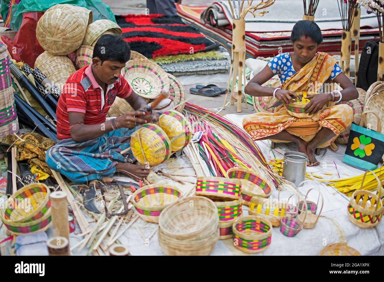 Kolkata, West Bengal, India - 28th November, 2015 : Couple weaving cane ...