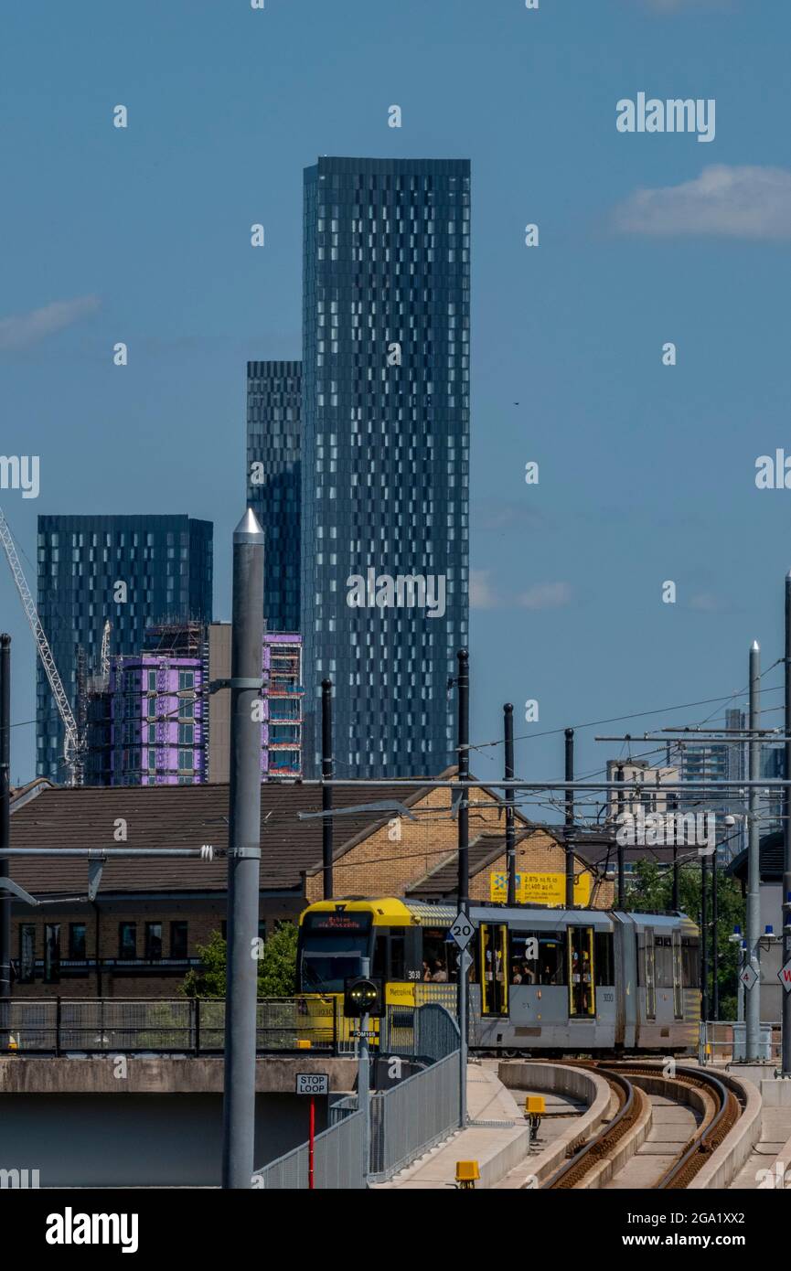 tram in greater manchester crossing a bridge on the public transport ...