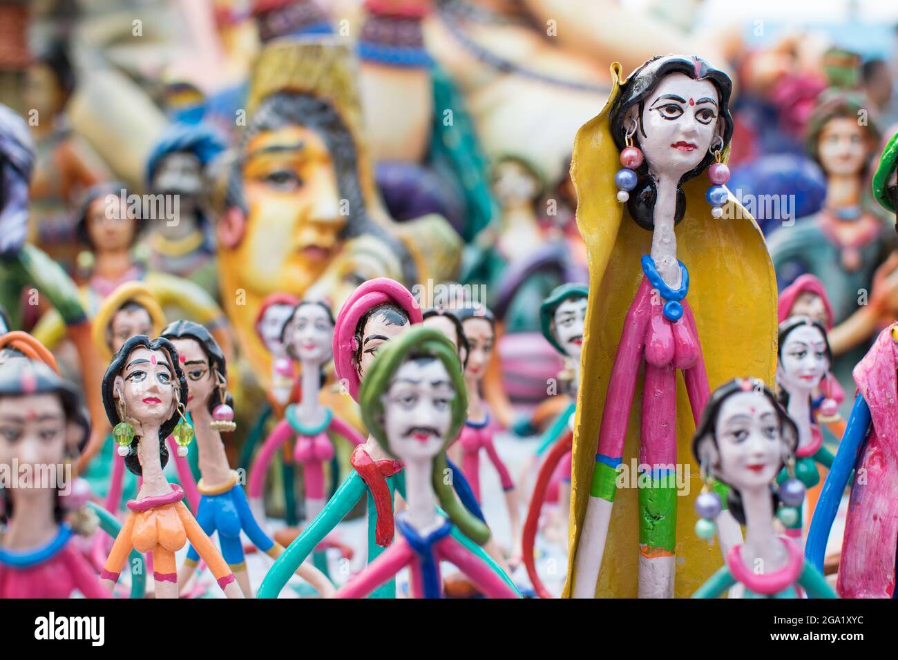 Colorful dolls made of clay, handicrafts on display during the ...