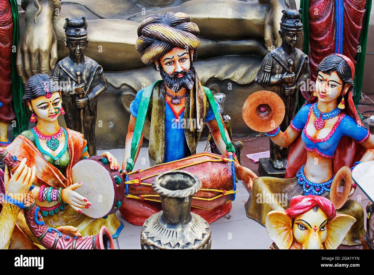 Colorful dolls and musical instruments made of clay, handicrafts on ...