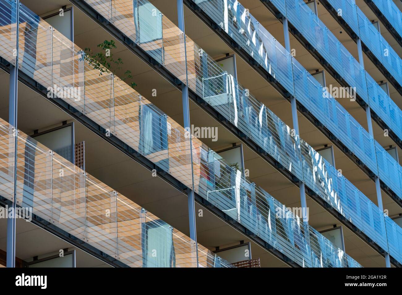 pattern formed by balconies on a multi storey block of flats with glass ...